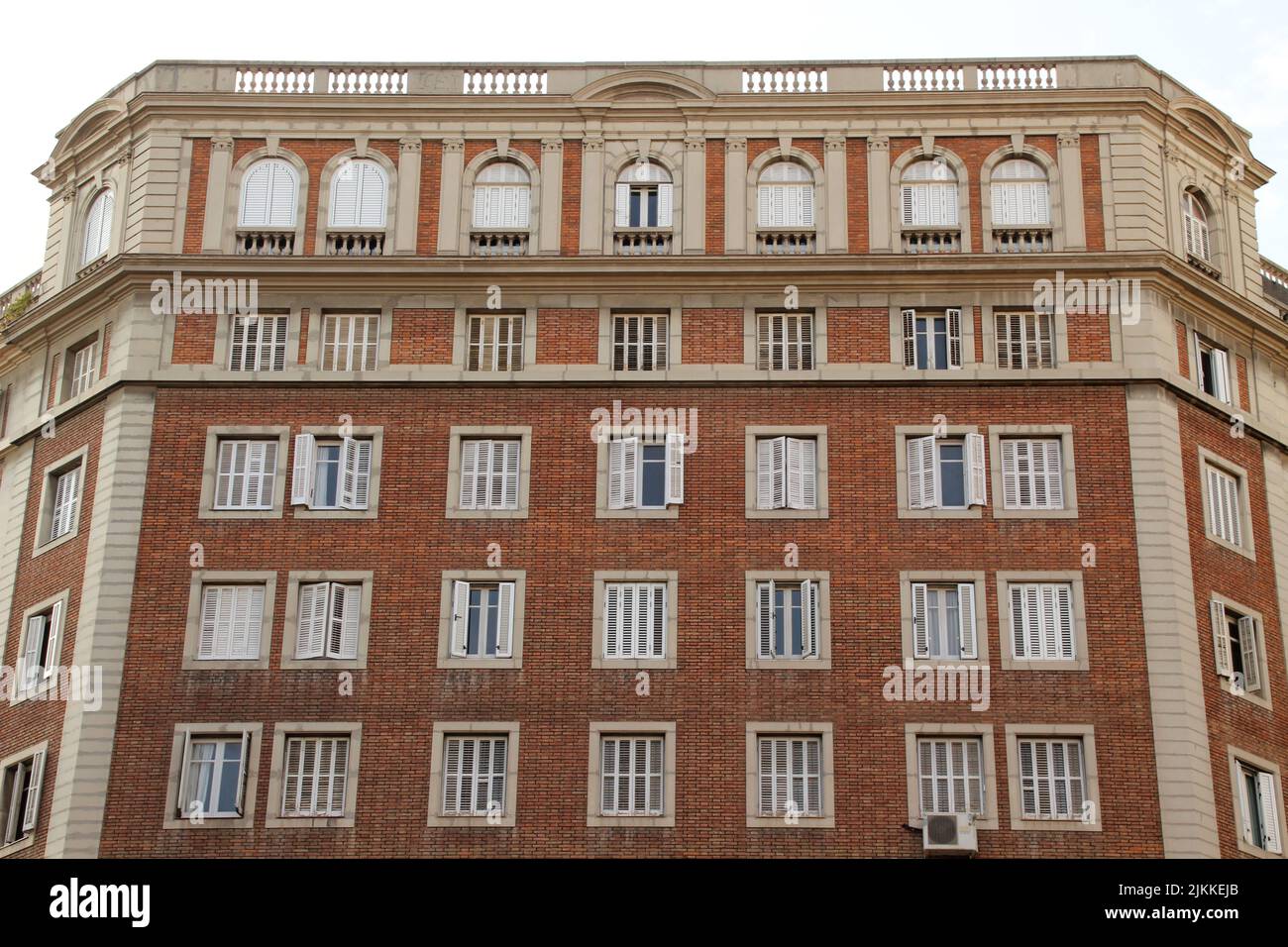 A view of last floors of brown building facade in Barcelona Stock Photo ...