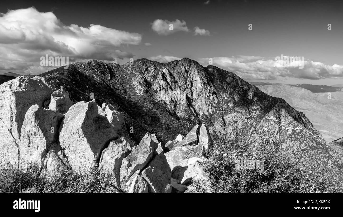 A grayscale aerial view of sharp cliffs under clouds Stock Photo - Alamy