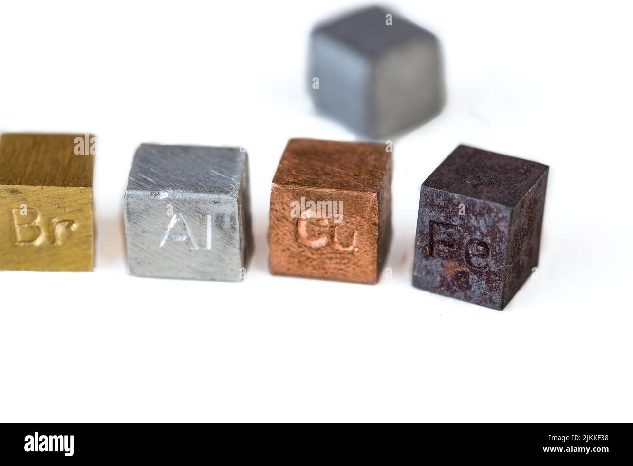 Different metal cubes on pure white background Stock Photo - Alamy