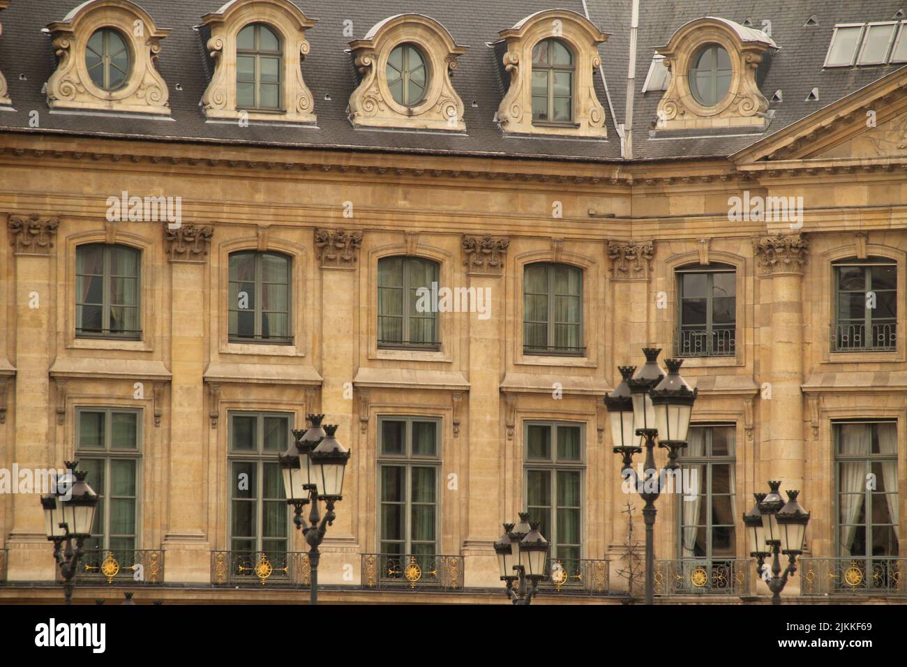 A beautiful view of an old building with small windows in the Paris ...