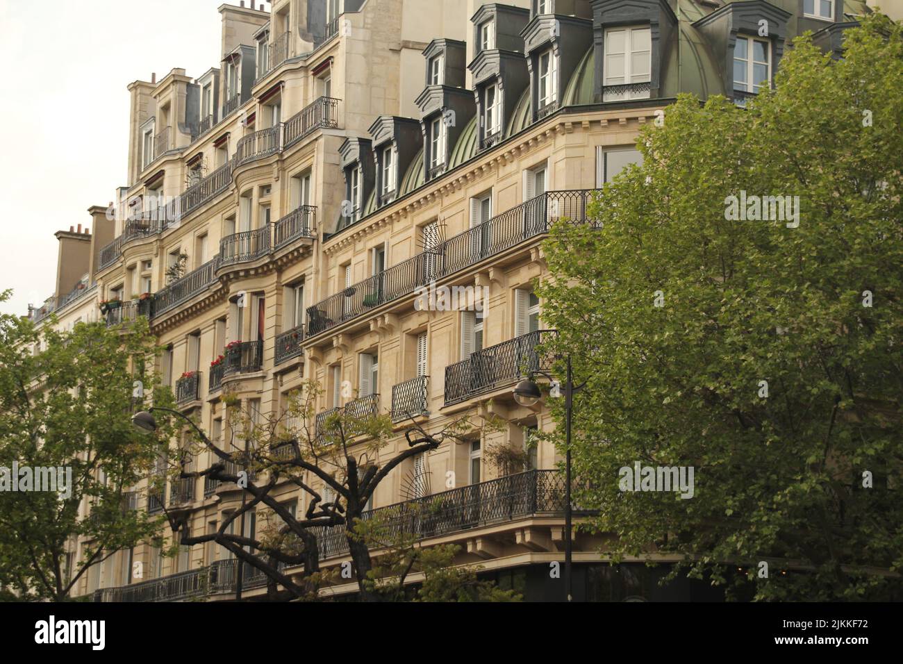 The facade of a beautiful, ornamental building with balconies in Paris ...