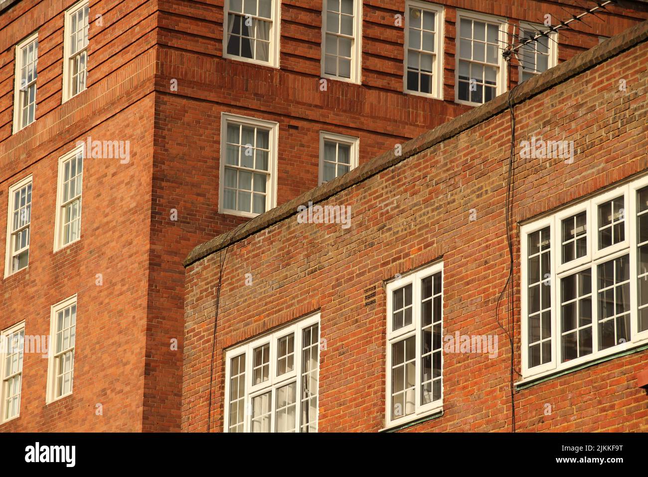 A old orange brick buildings facades in London Stock Photo - Alamy