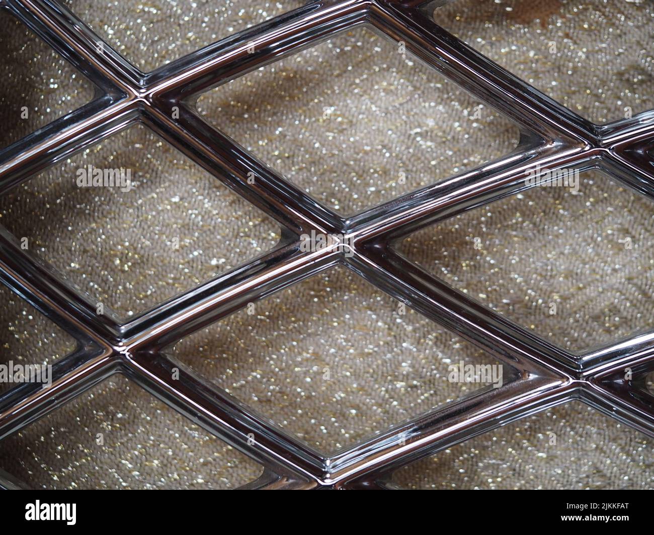 A closeup shot of shiny glass texture with shiny metal pattern for ...