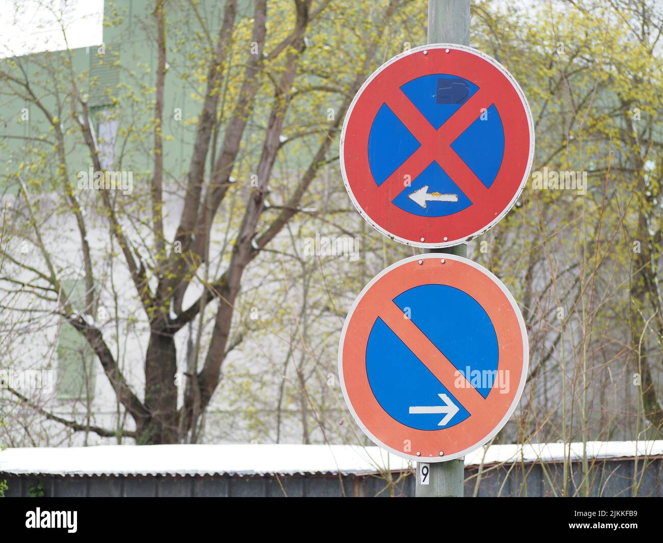 Two signs for no parking in the street on a blurred background Stock ...