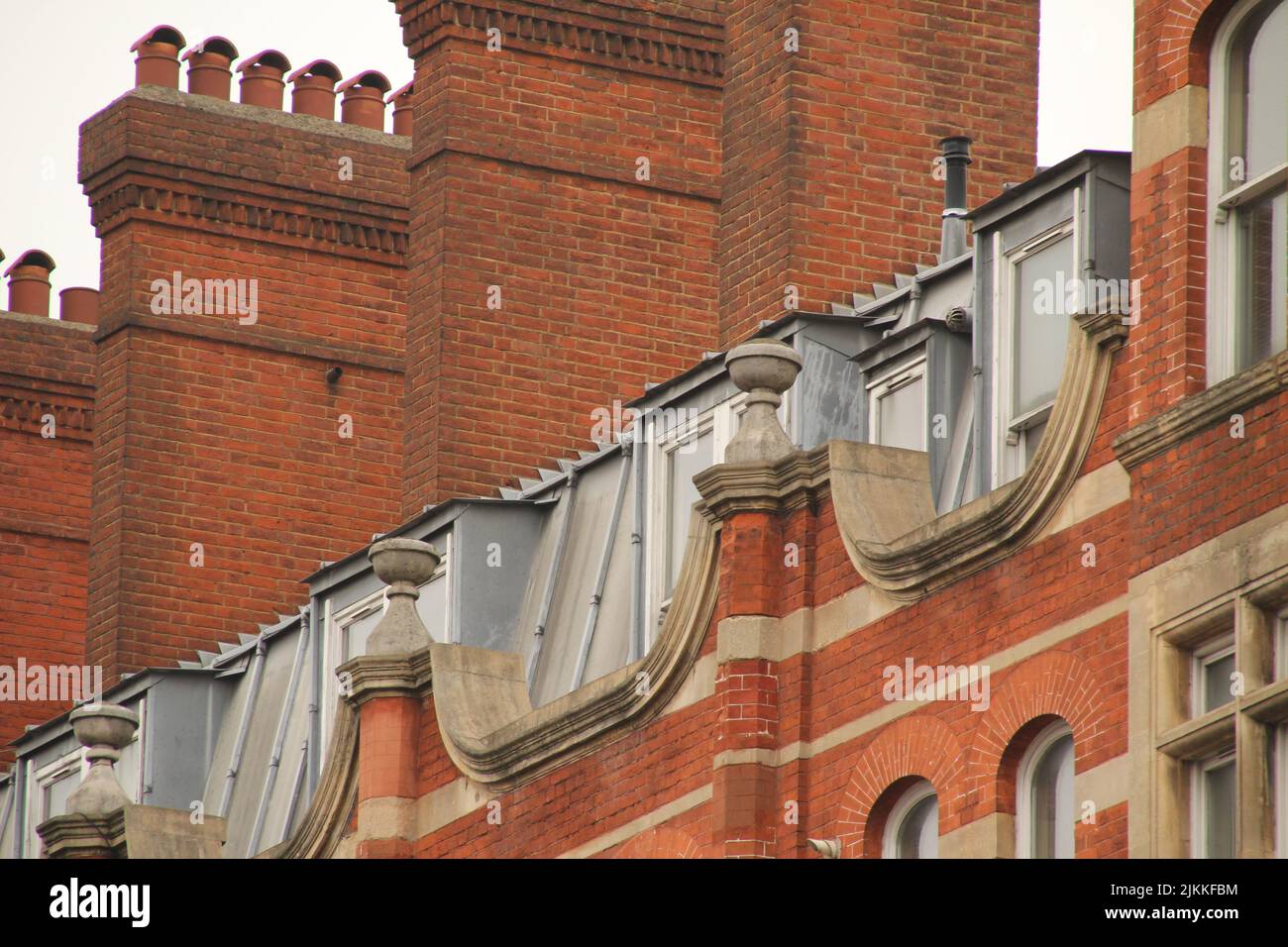 A view of last floors of brown building facade in London Stock Photo ...