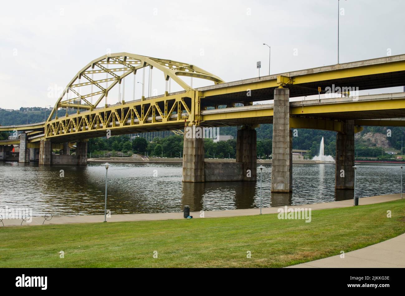 A shot of the Pittsburgh yellow arch Fort Pitt bridge over the ...