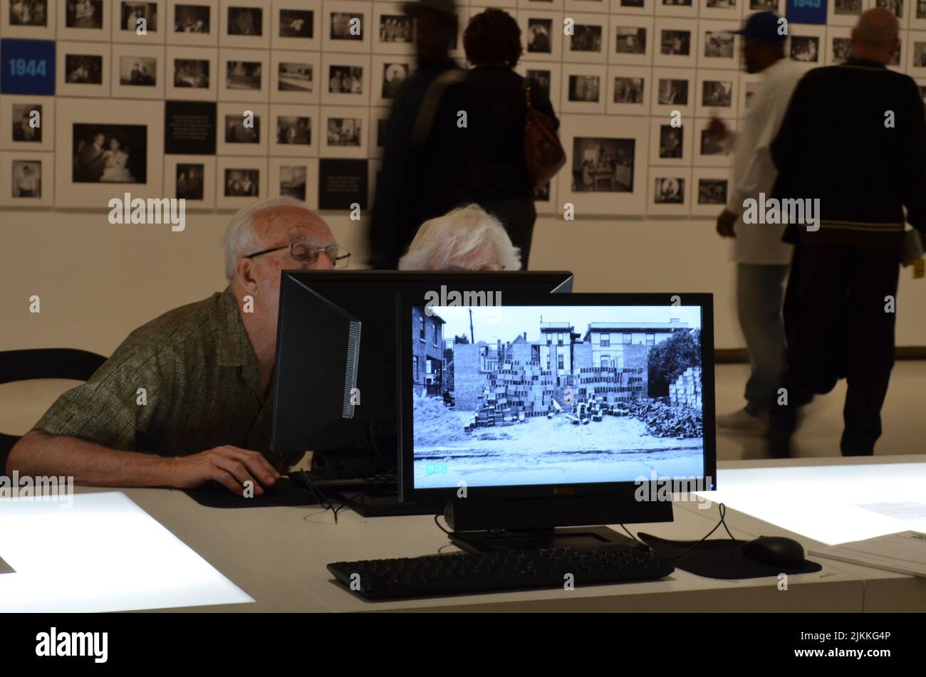 An older couple looking at history on a computer screen at the Carnegie ...