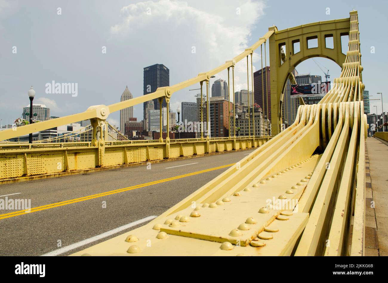 A gorgeous low angle shot of the Pittsburgh yellow bridge railings and ...
