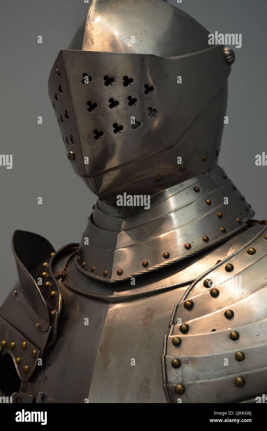 A vertical shot of the top of medieval knight armor made of metal with ...