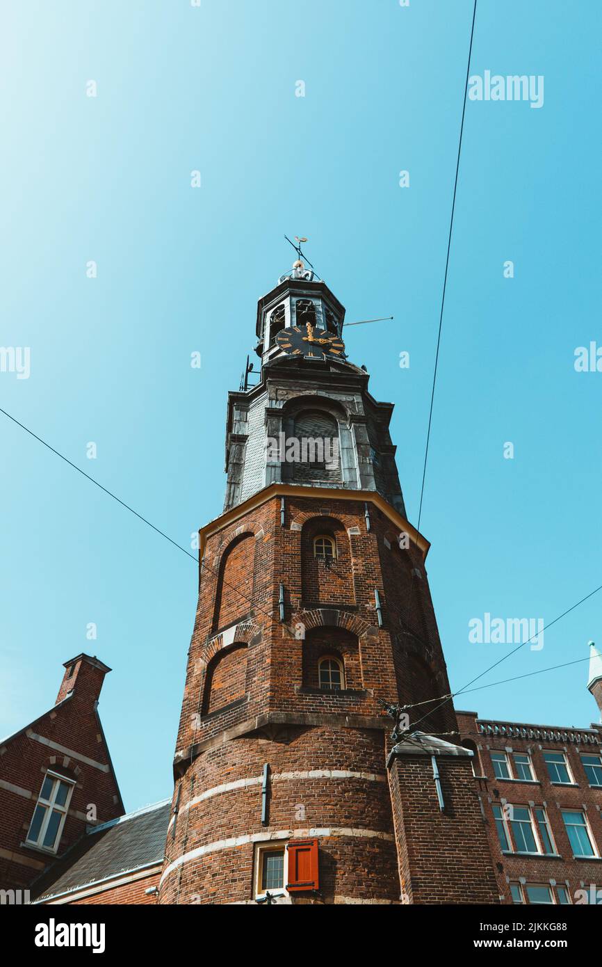 A vertical shot of a clock tower in Amsterdam Stock Photo - Alamy