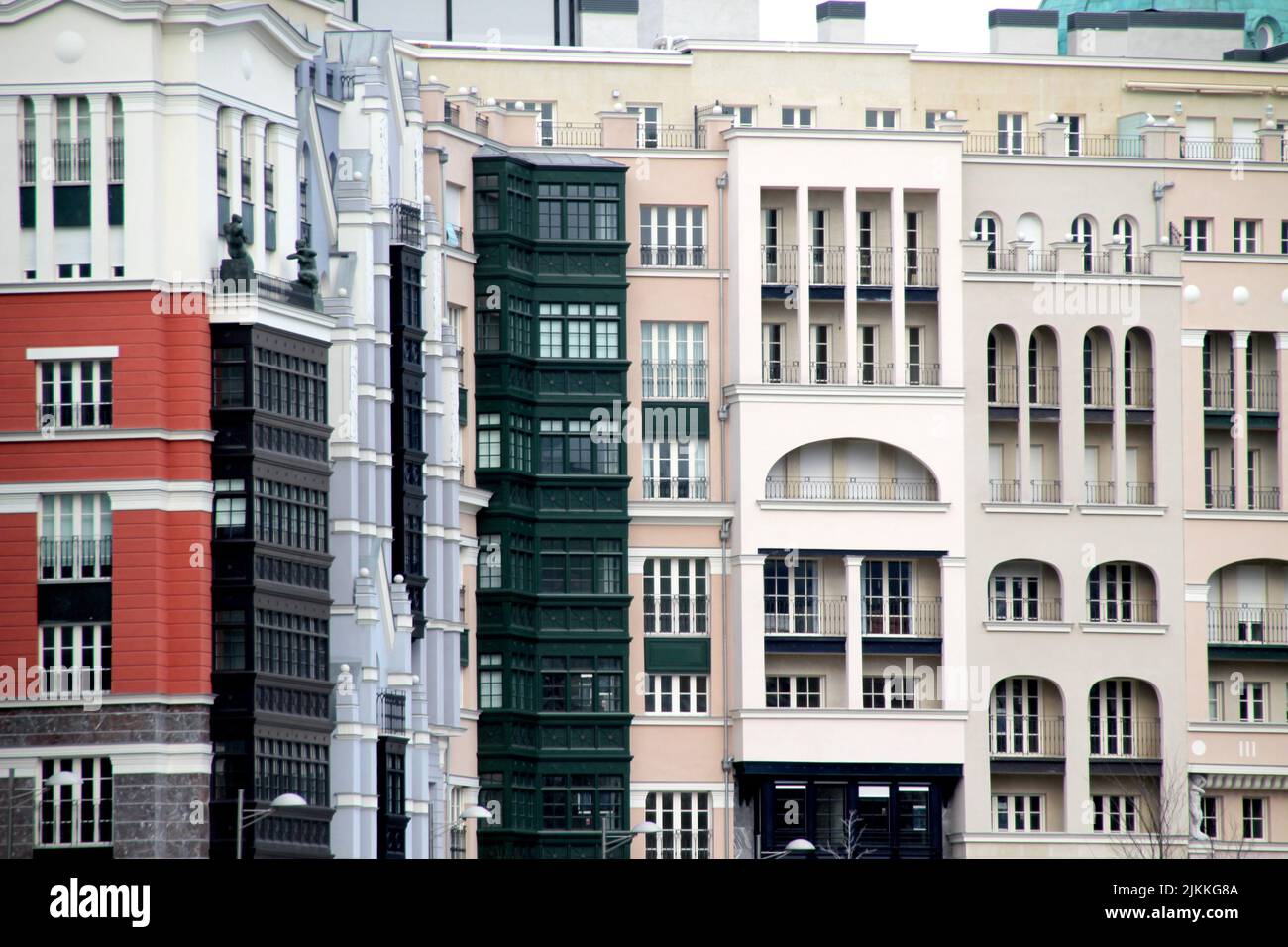 A beautiful view of apartment buildings with small windows in the ...