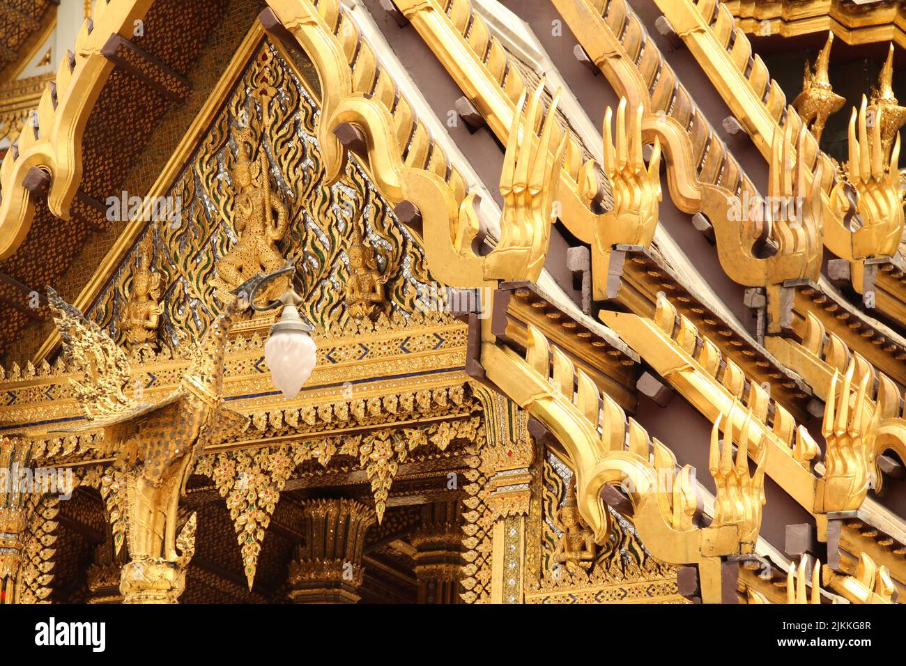 A view of a temple roof with golden decorations in Bangkok Stock Photo ...