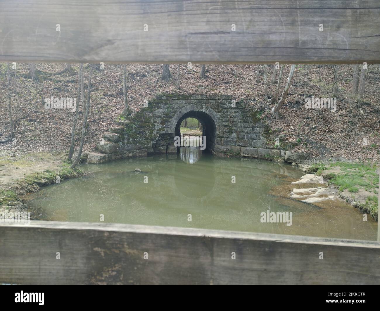 A water flowing out of the pond into the tunnel Stock Photo - Alamy