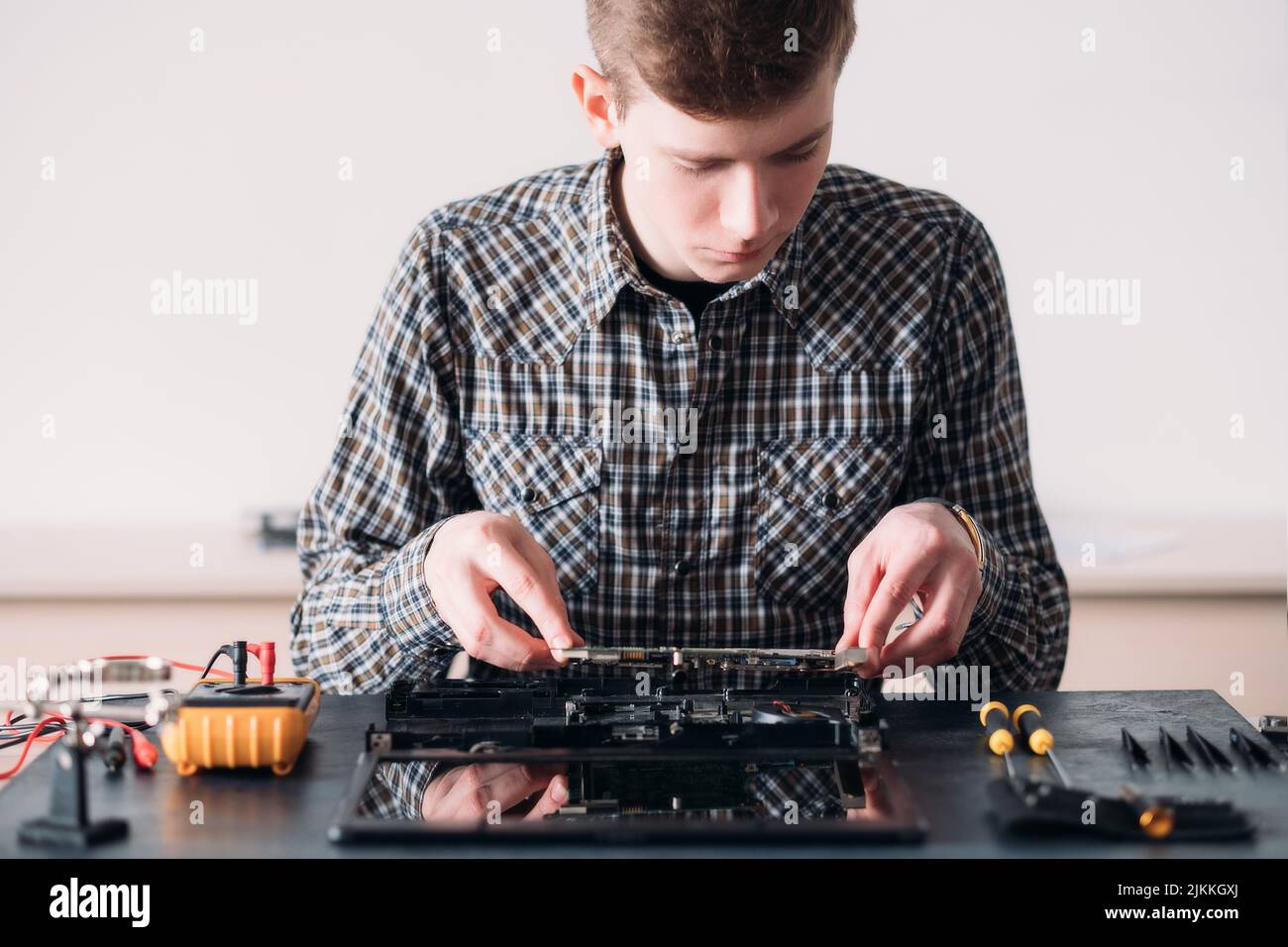 microelectronics repair shop disassembled laptop Stock Photo - Alamy