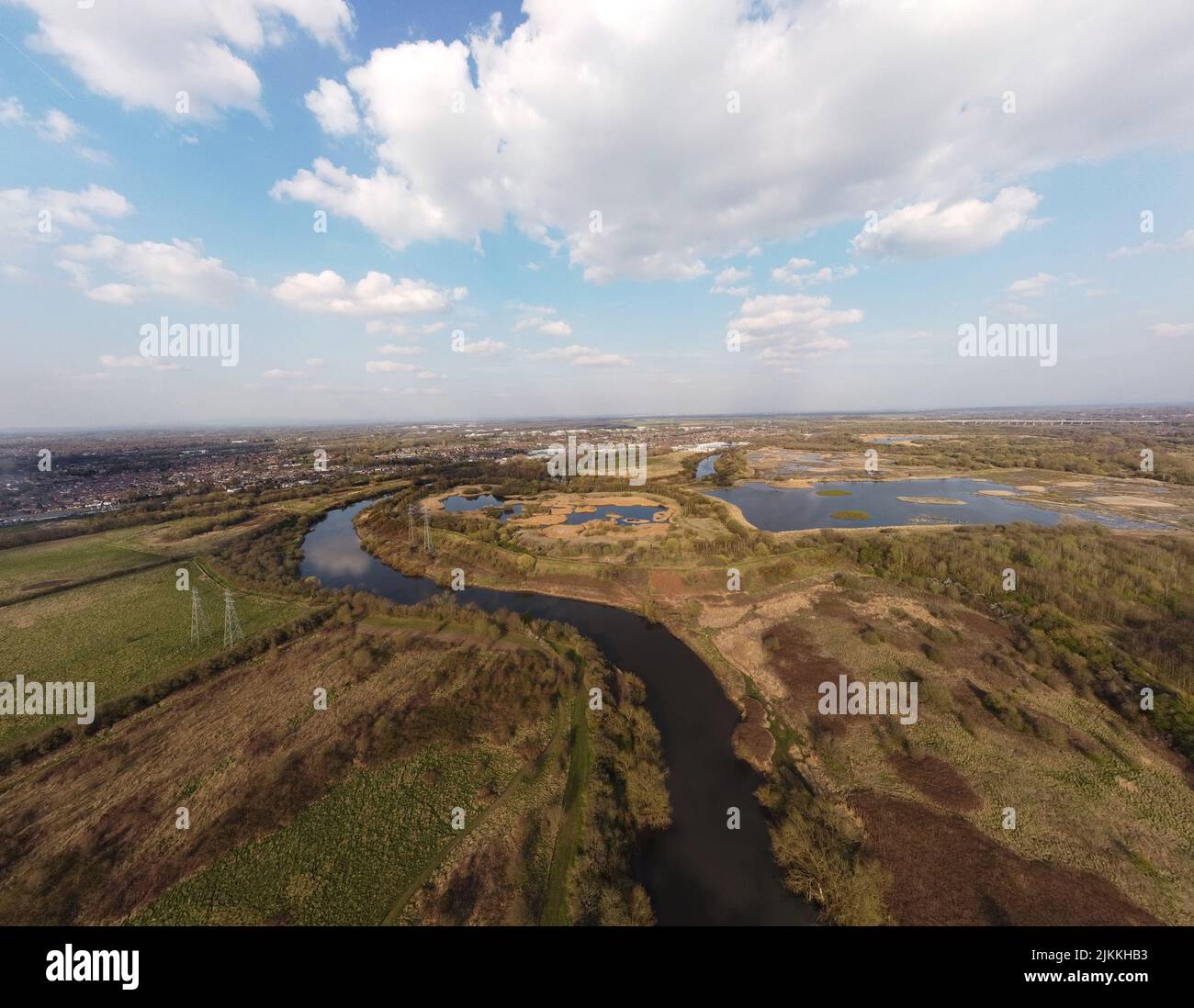 An aerial view of a river and wetlands surrounded by dry plants Stock ...