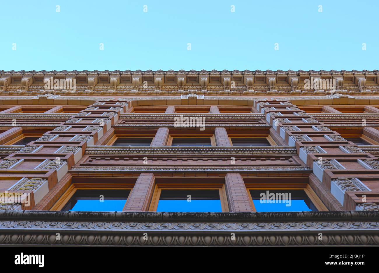 A low angle shot of a beautiful building with small details on it under ...
