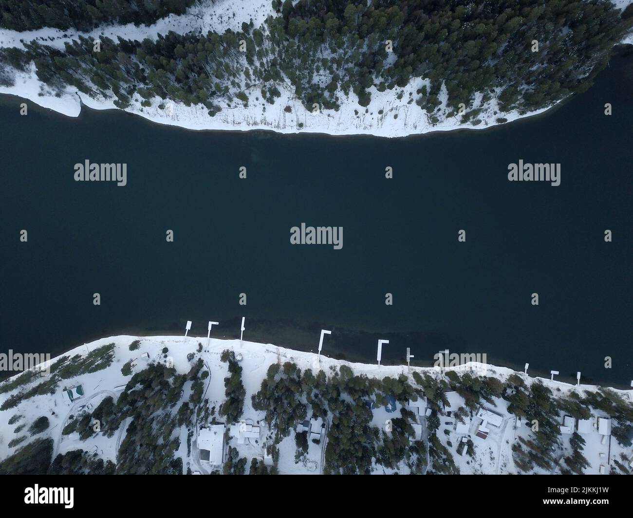A bird's eye view of beautiful snowy islands with the ocean separating ...