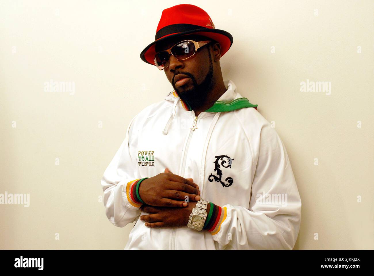 A closeup of singer and guitarist Wyclef Jean posing in front of a ...