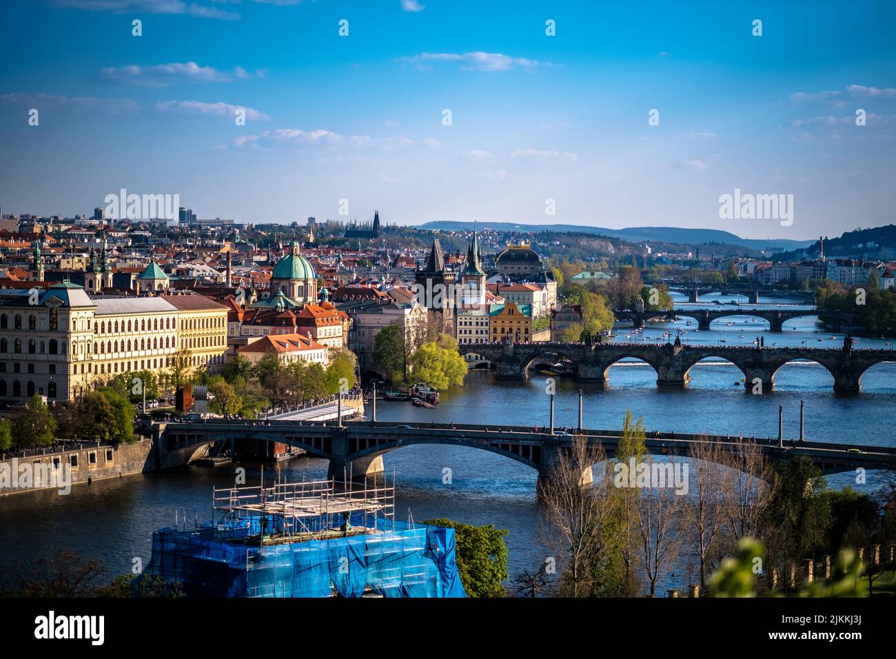 A beautiful view of the Vltava river under bridges in the Prague city ...
