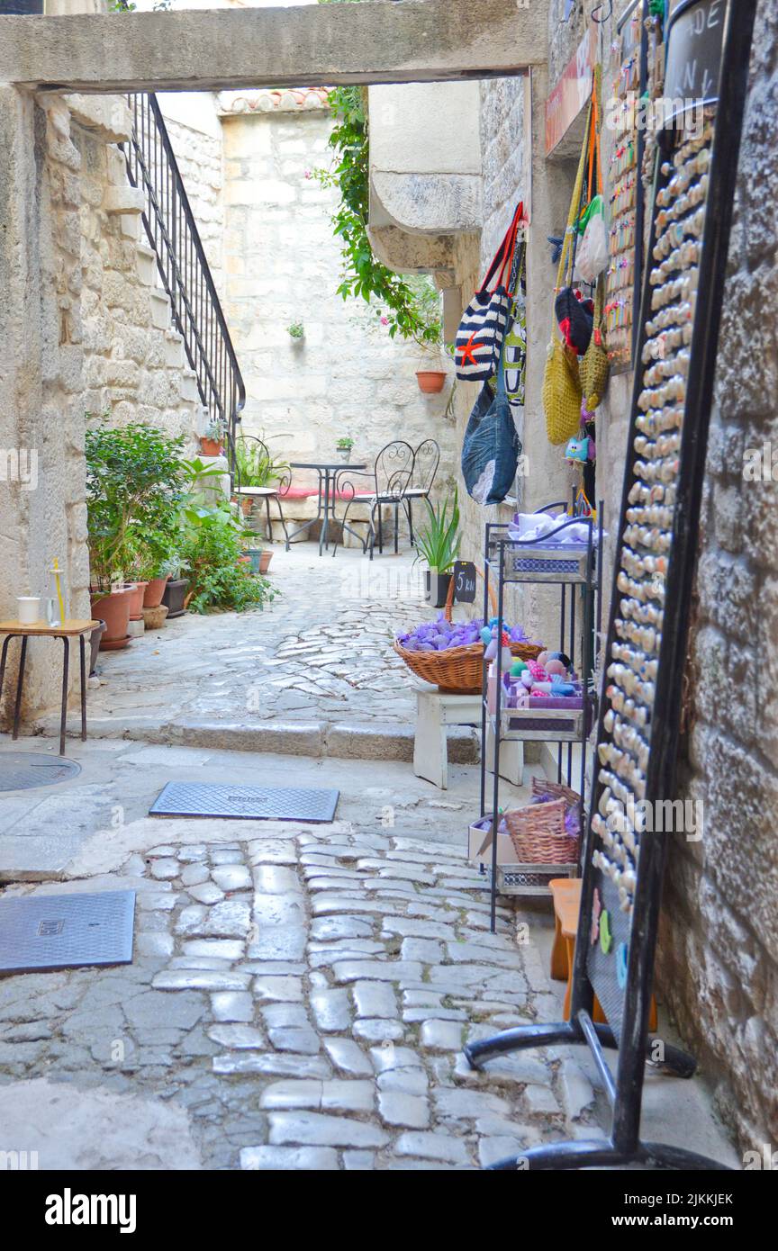A small street in the medieval quarter of Trogir, an old Croatian town ...