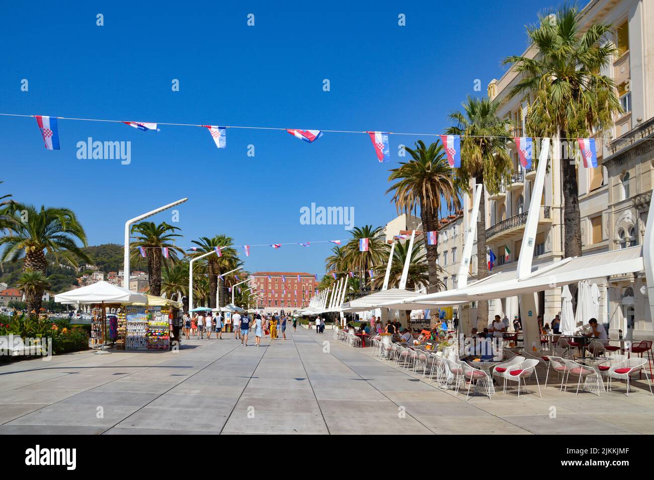 A group of people enjoying their time in a beautiful outdoor cafe ...