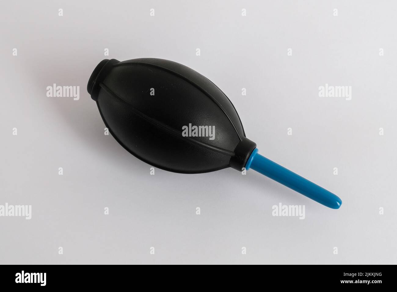 A close-up shot of a lens cleaner blower isolated on a white background ...