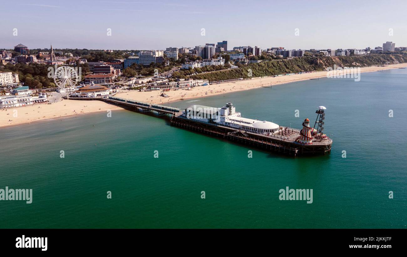 An aerial landscape shot of the Bournemouth Pier, a Tourist attraction ...