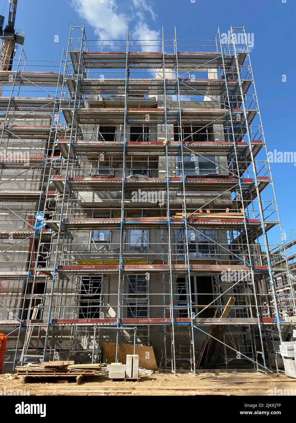 A vertical low angle shot of a half finished building Stock Photo - Alamy