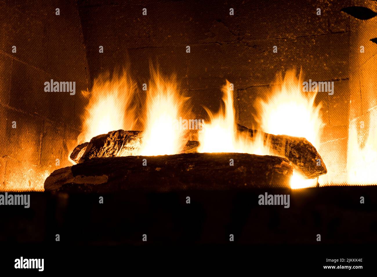 Pieces of wood being burnt with flames in a chimney Stock Photo - Alamy