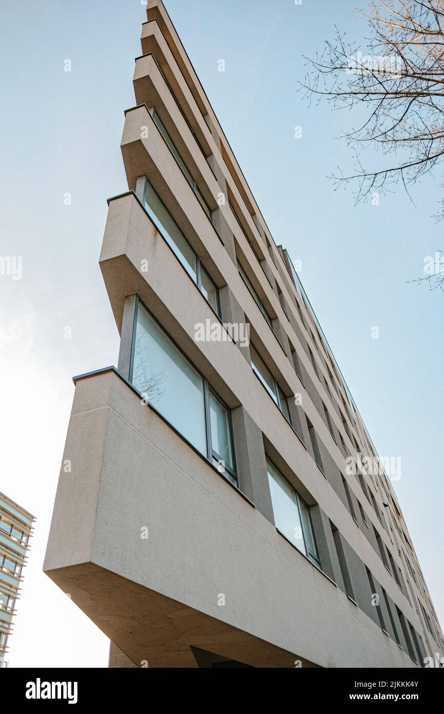 A vertical low angle shot of a high-rise building in the historic city ...