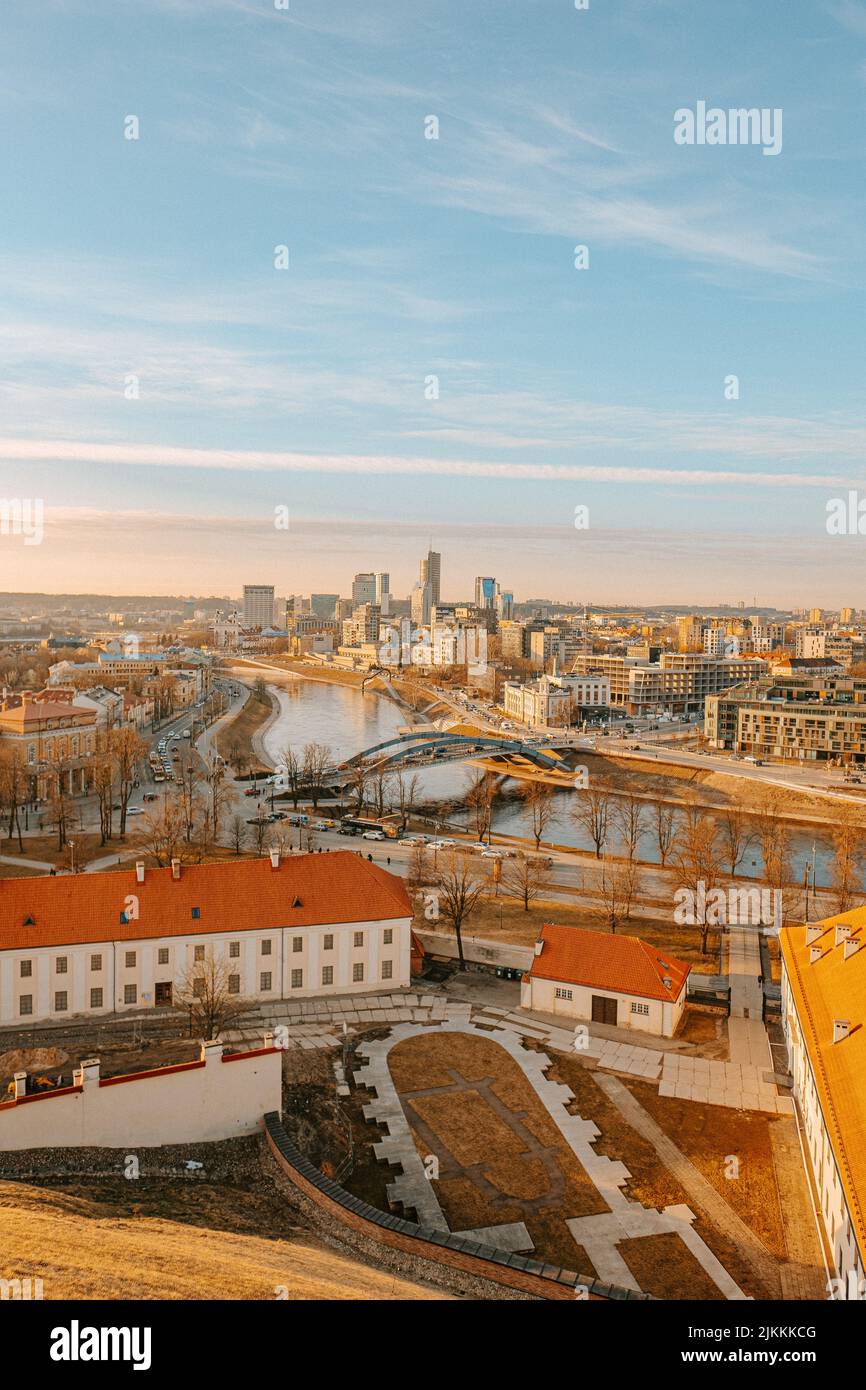 A vertical high angle shot of a Vilnius city red roof buildings and a ...