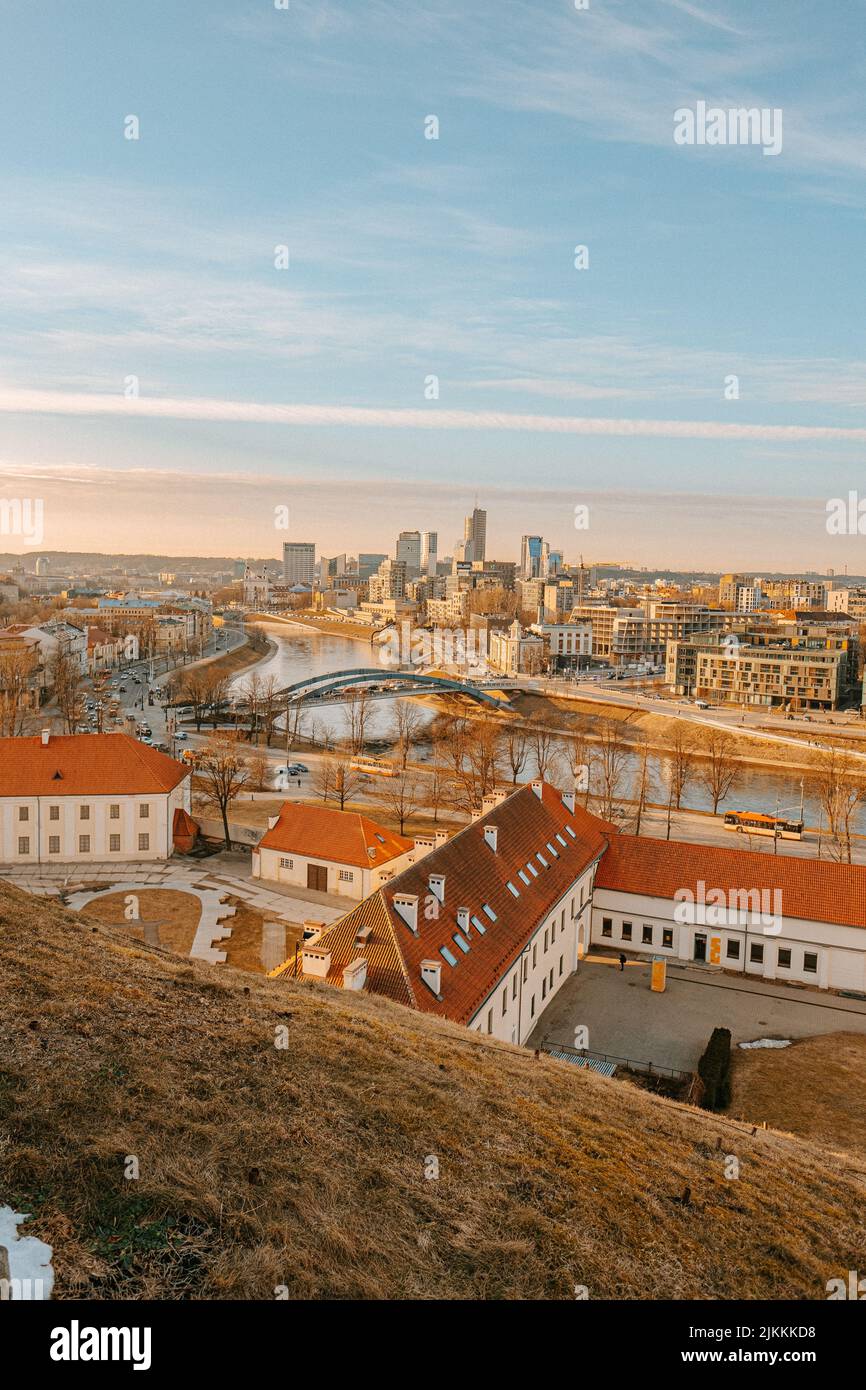 A vertical high angle shot of a Vilnius city red roof buildings and a ...