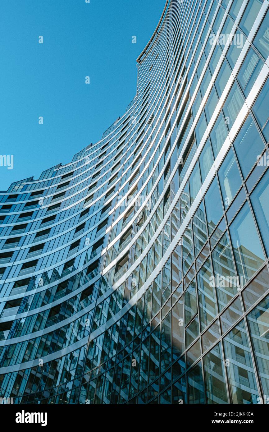 A low angle shot of a glazed facade of a modern building in a Vilnius ...