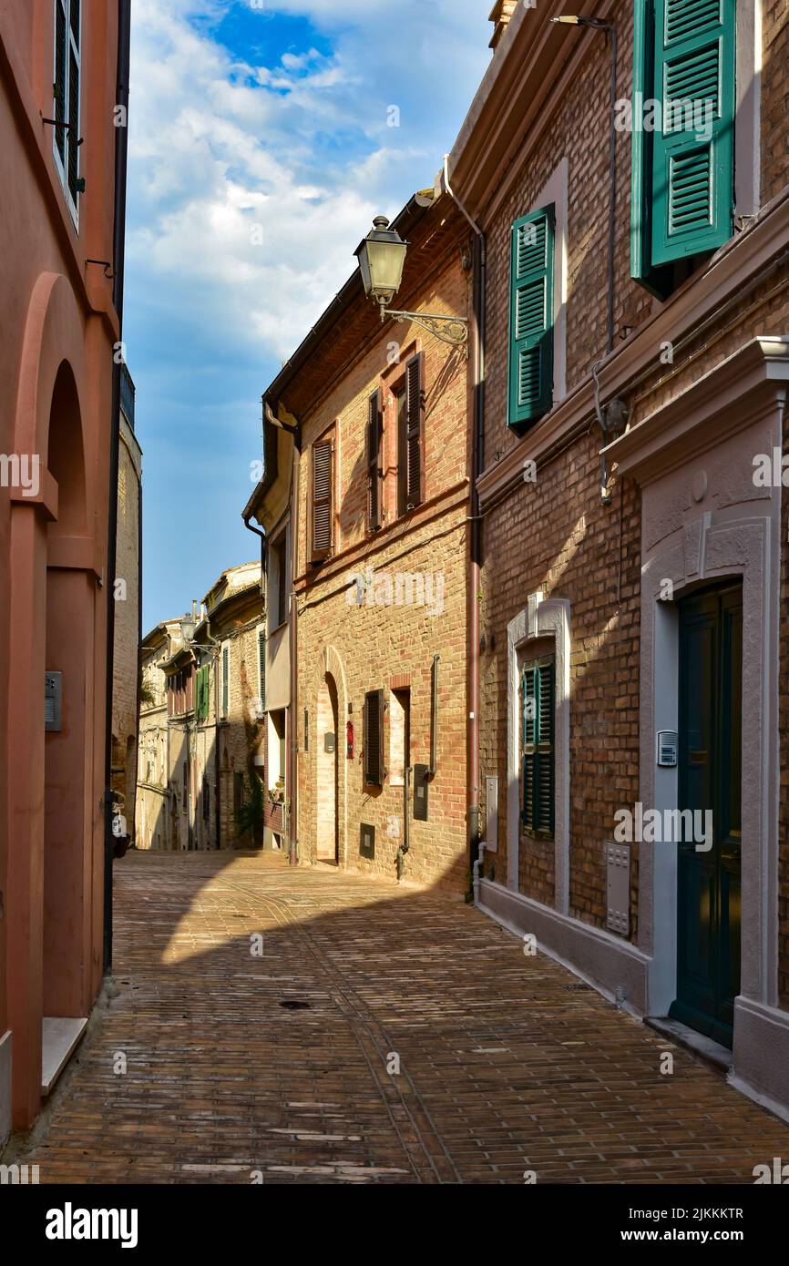 A vertical shot of a narrow street of Civitanova Alta town in the ...
