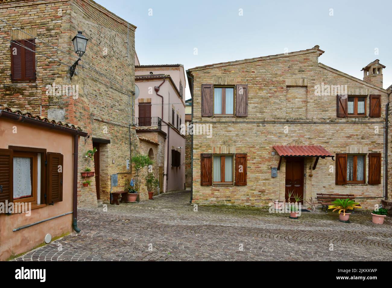 A narrow street of Civitanova Alta town in the Marche region of Italy ...