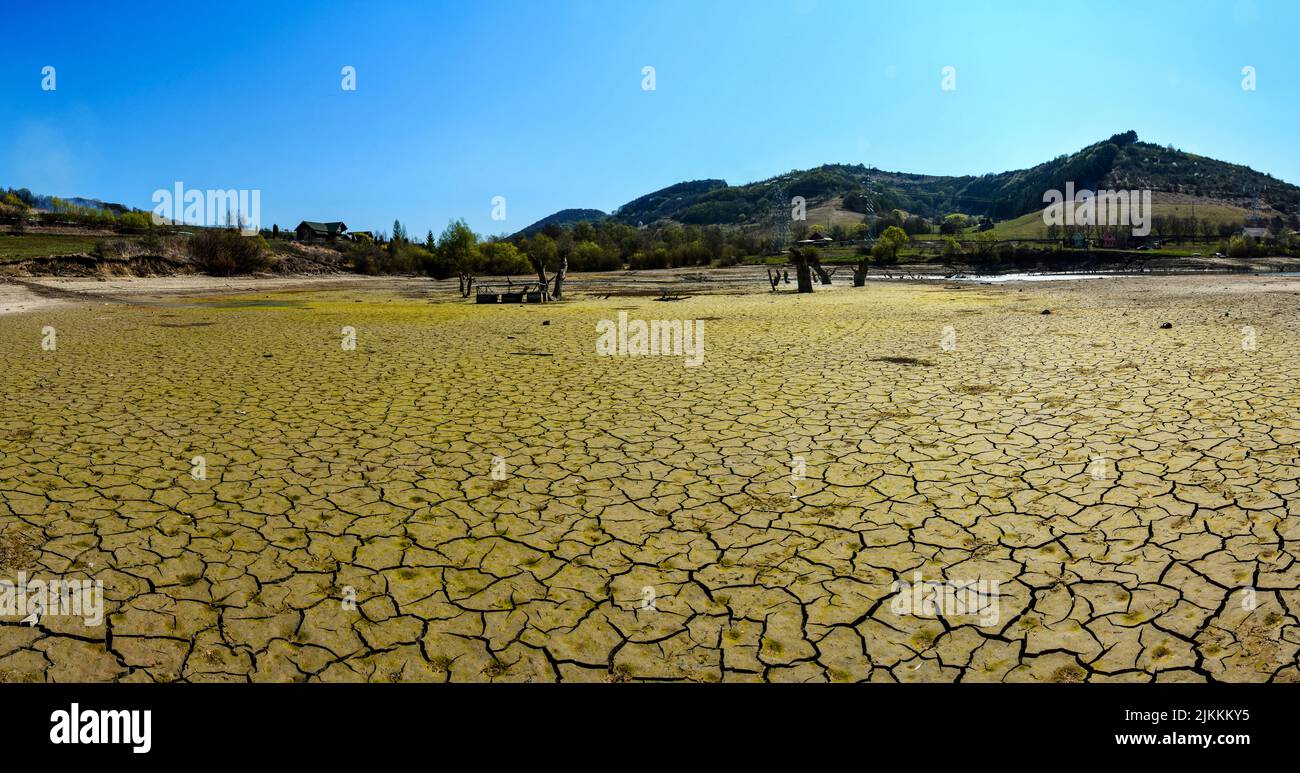A panoramic view of a landscape with cracked soil due to drought Stock ...