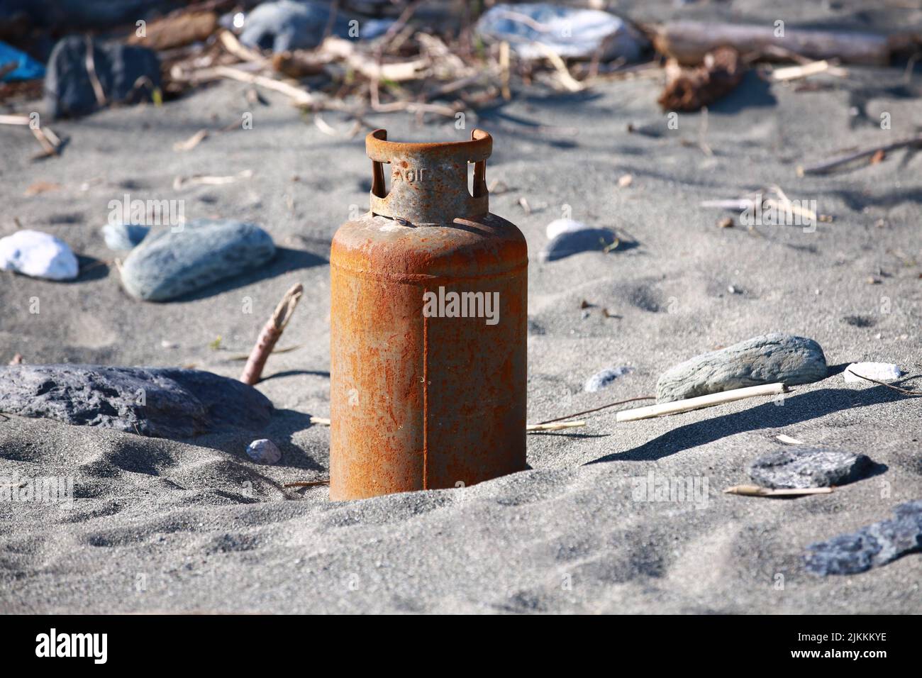 A closeup of the remnant of an old gas cylinder on the beach Stock ...