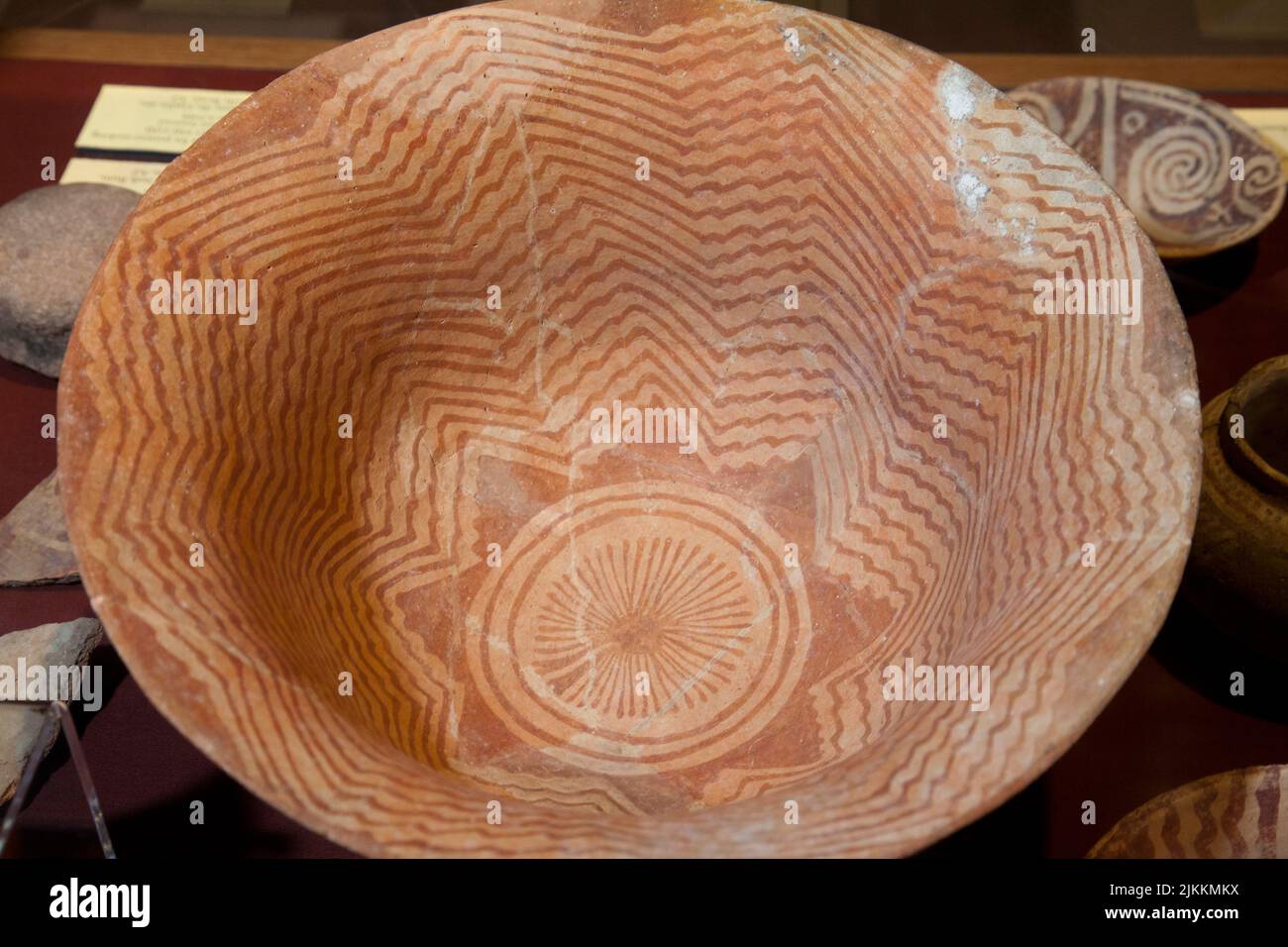 Painted designs of red on red clay pottery dish from the early Hohokam ...