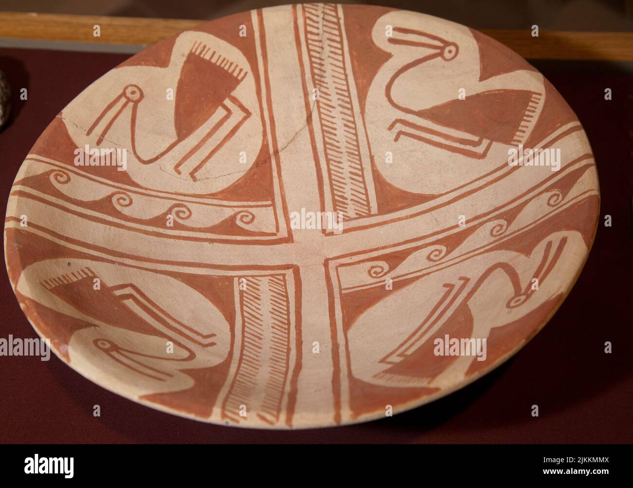 Painted designs of red on red clay pottery dish from the early Hohokam ...