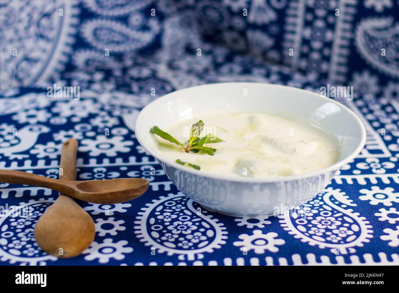 Georgian traditional food Gebjalia, cheese in milk and greens, species ...