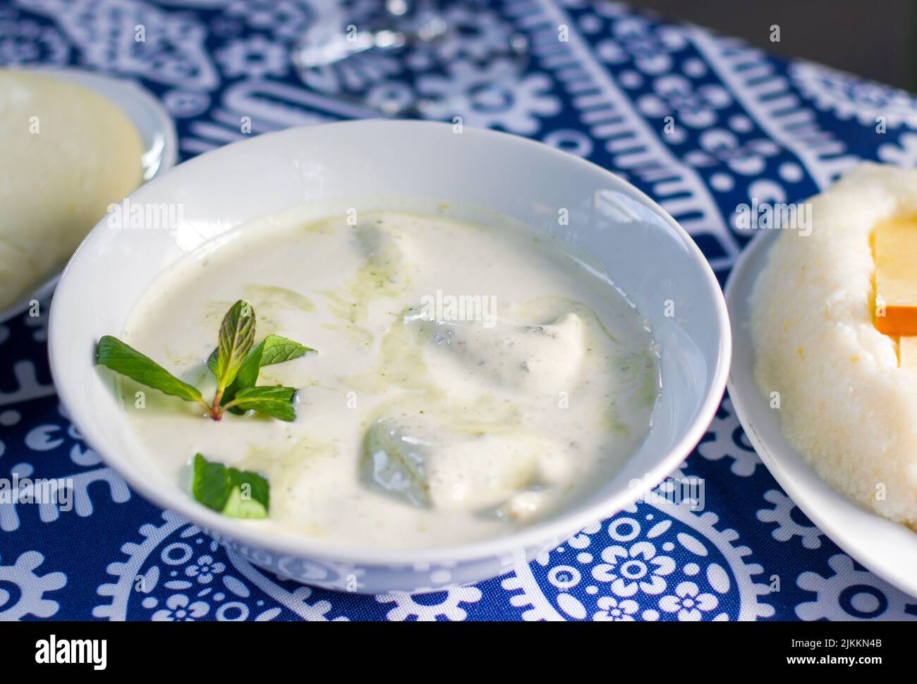 Georgian traditional food Gebjalia, cheese in milk and greens, species ...