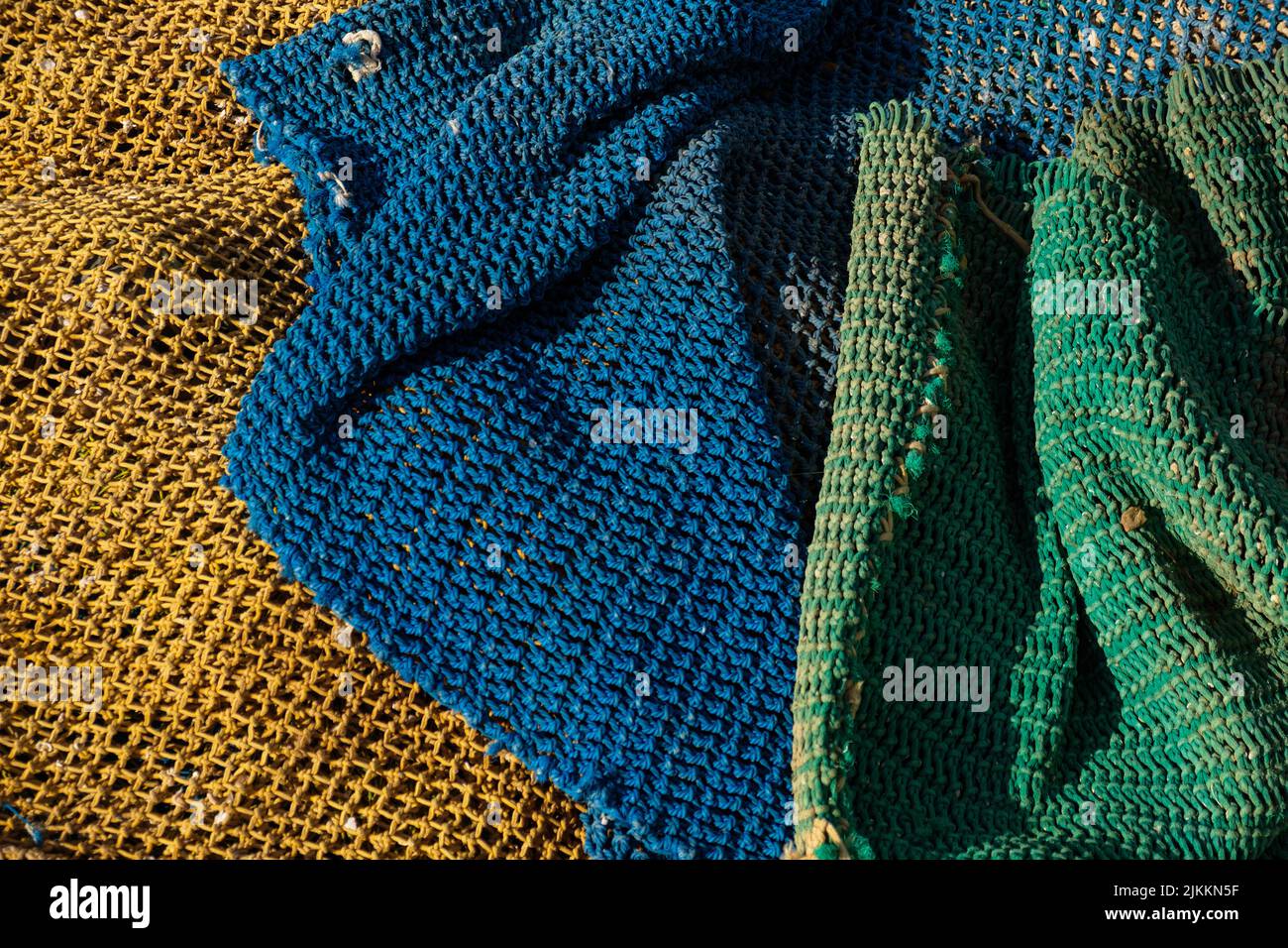 A closeup of colorful fishing nets under the sunlight Stock Photo - Alamy