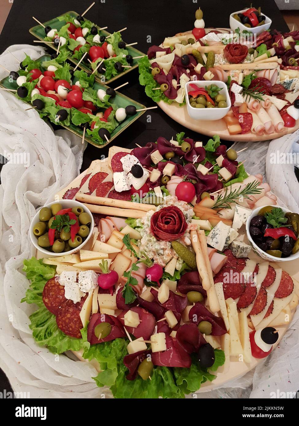 A vertical closeup of various cold appetizers with beautiful ...