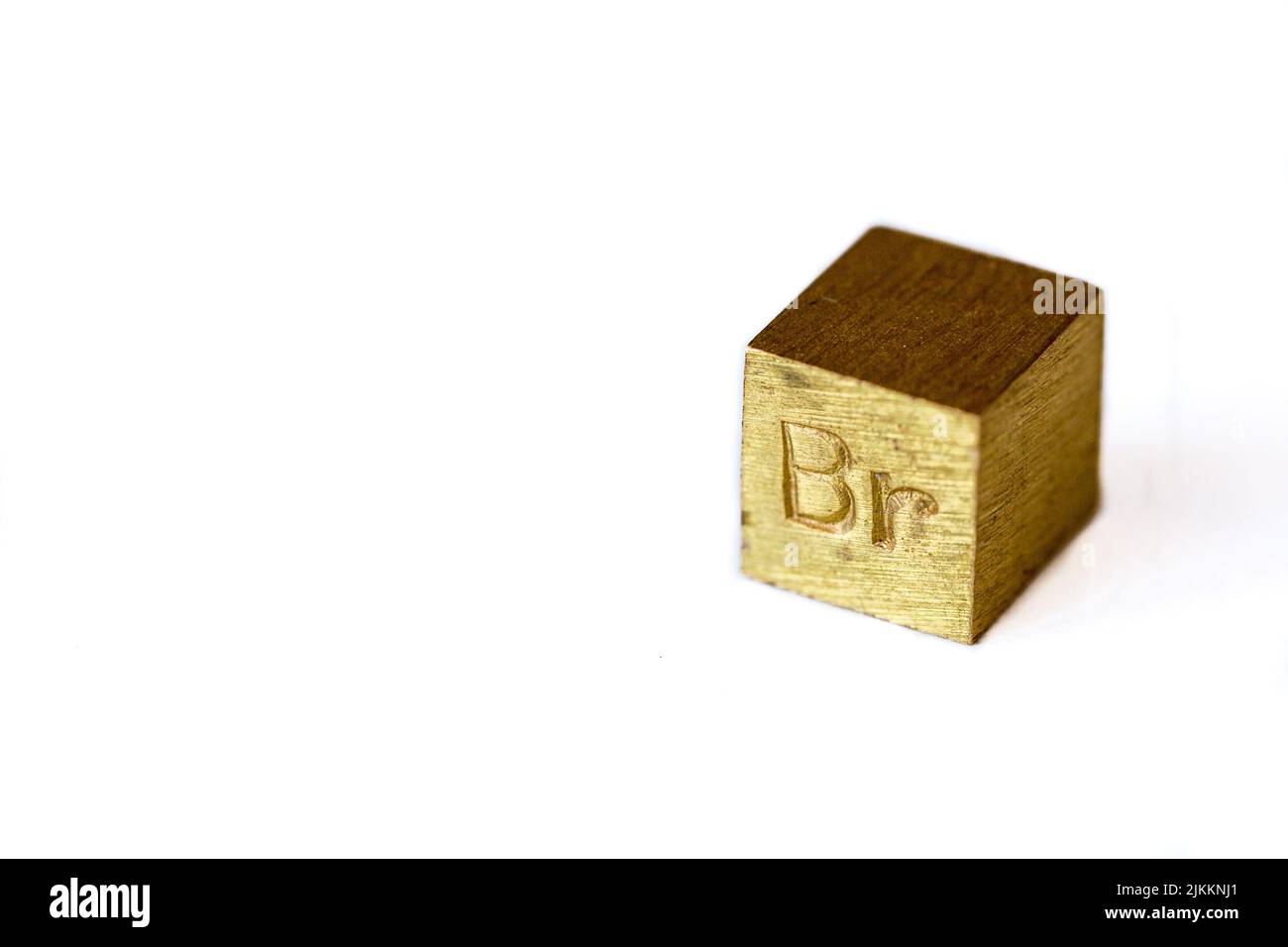 Brass cube with alloy name Br on it on white background Stock Photo - Alamy