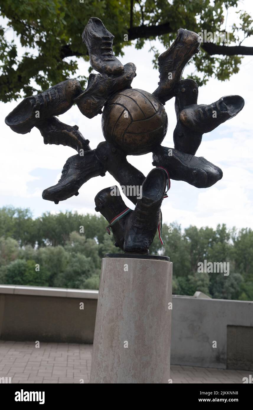 Football ball and shoes statue in Szeged,Hungary Stock Photo - Alamy