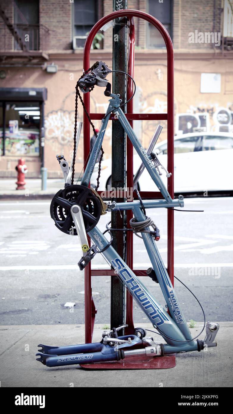 A bicycle locked to a post without wheels Stock Photo - Alamy
