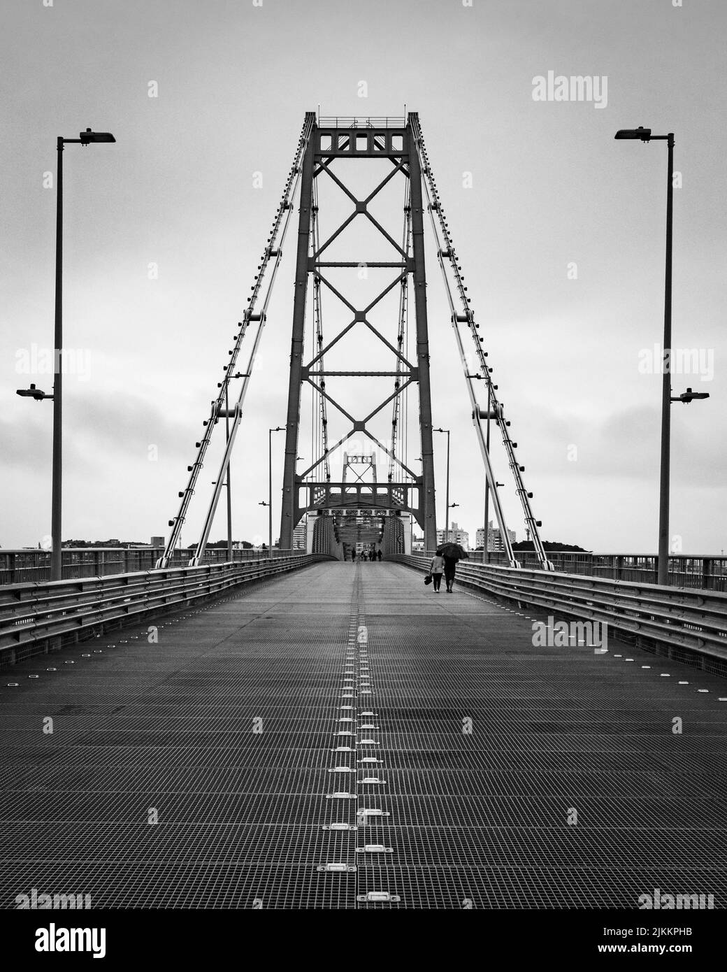 A closeup greyscale of a long metal bridge path in Sout5hern Brazil ...
