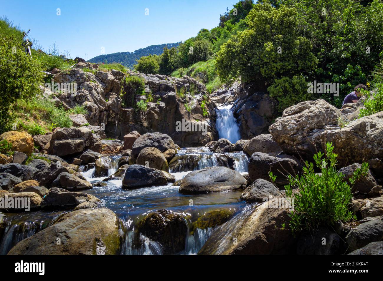 A beautiful shot of a flowing rocky waterfall in Golan Heights, Israel ...