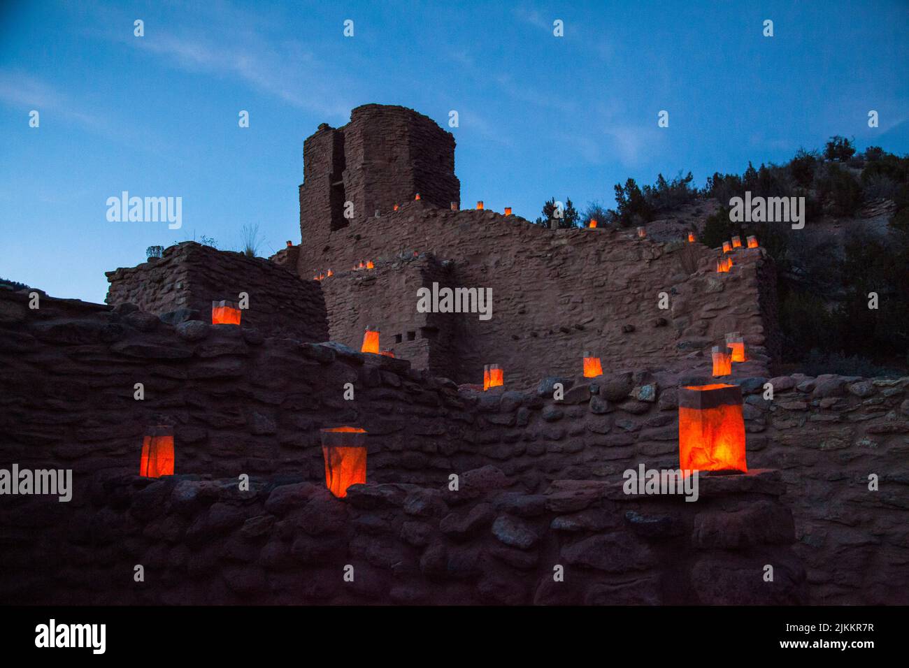 Luminarias light the pathways of the Jemez Mission State Monument at ...