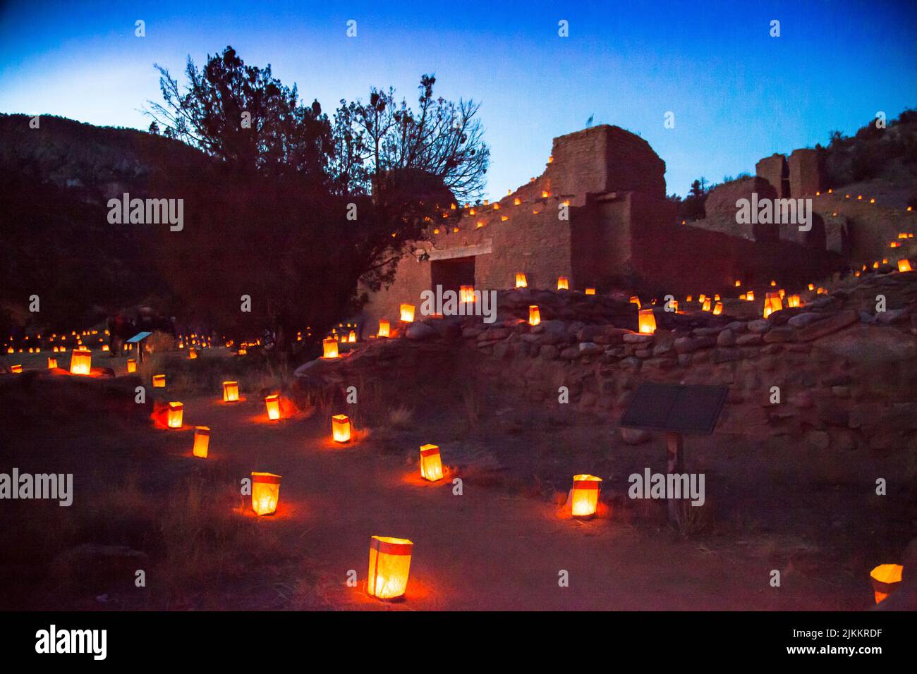 Luminarias light the pathways of the Jemez Mission State Monument at ...